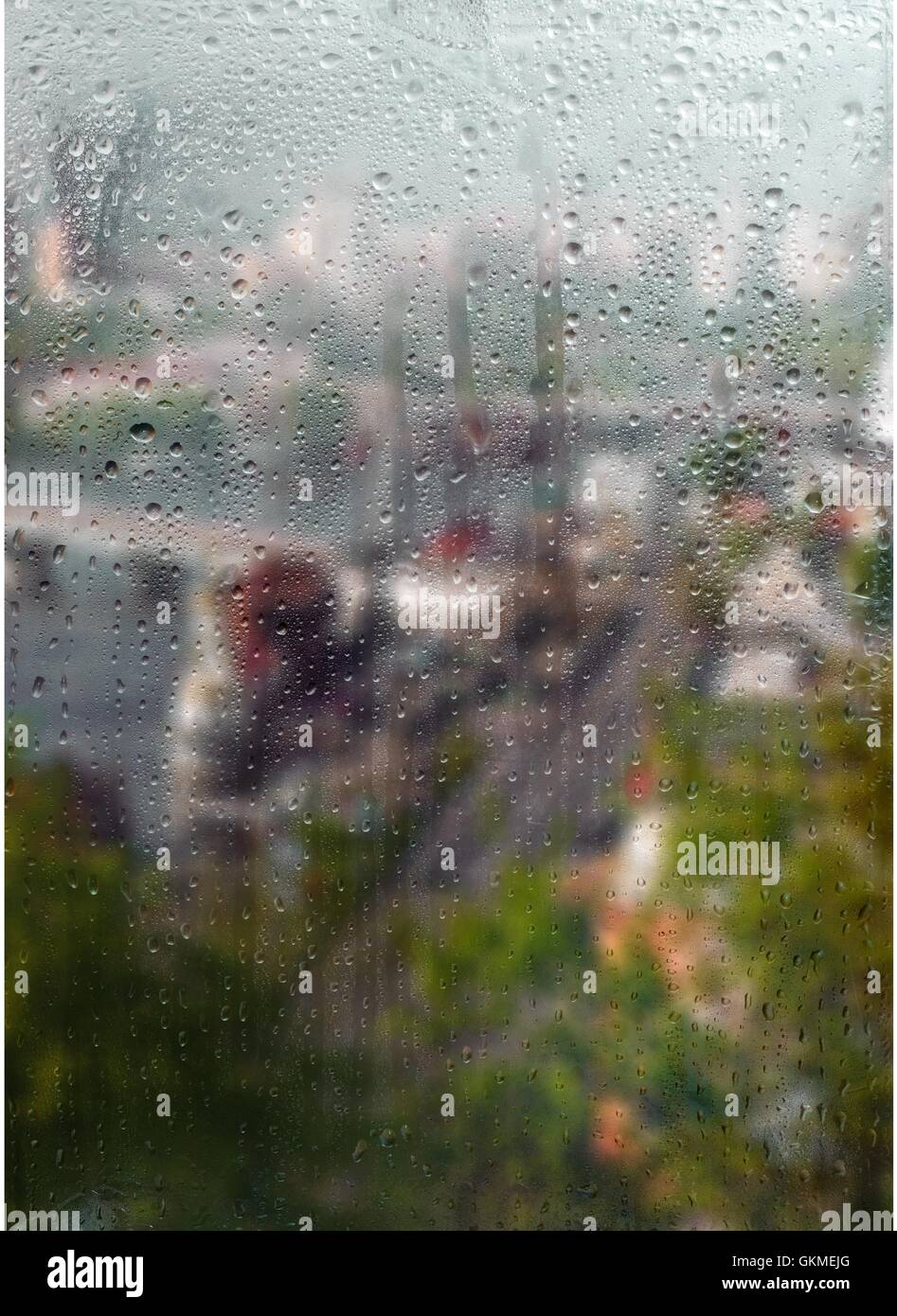 Autumn, rainy city through a window with raindrops Stock Photo - Alamy