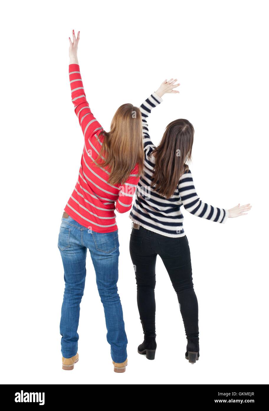Back view of two young brunette standing woman Stock Photo - Alamy
