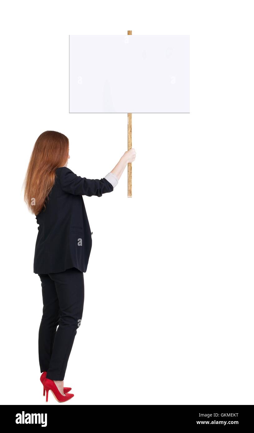 Back view business woman showing sign board Stock Photo - Alamy