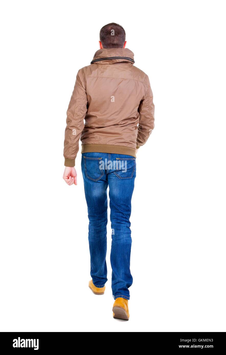Back view of going handsome man in jeans and jacket Stock Photo - Alamy