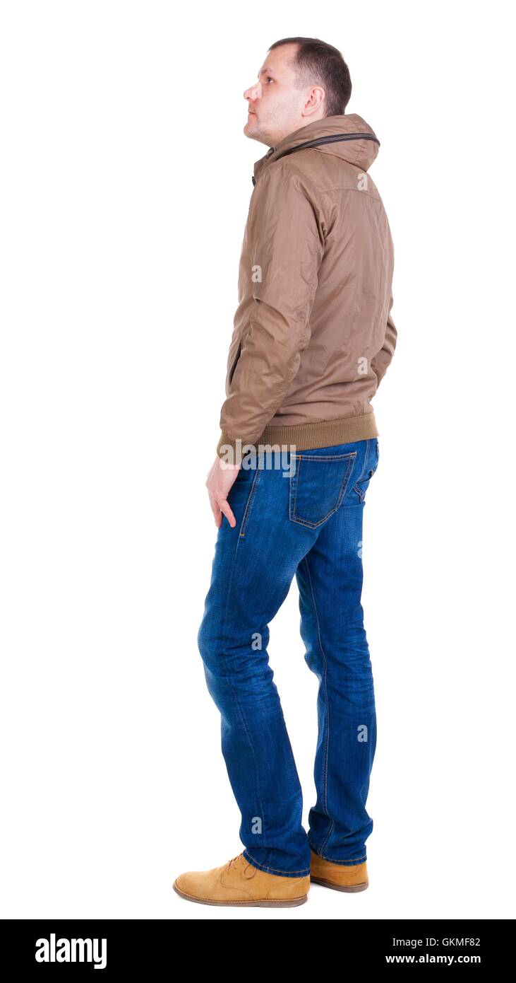 Back view of handsome man in brown windcheater looking up Stock Photo ...