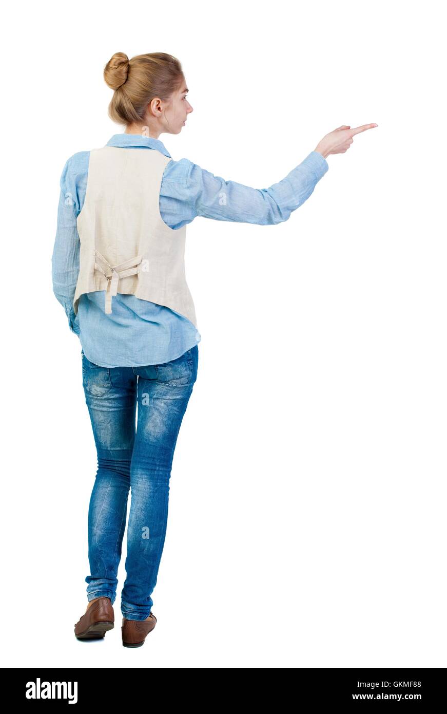Back view of pointing woman Stock Photo - Alamy
