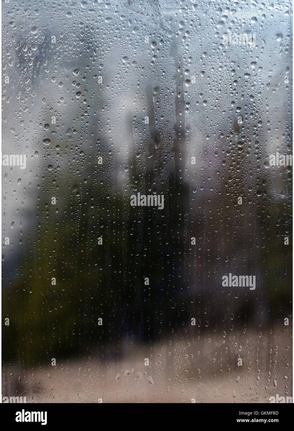 Rainy autumn landscape through a window with raindrops Stock Photo - Alamy