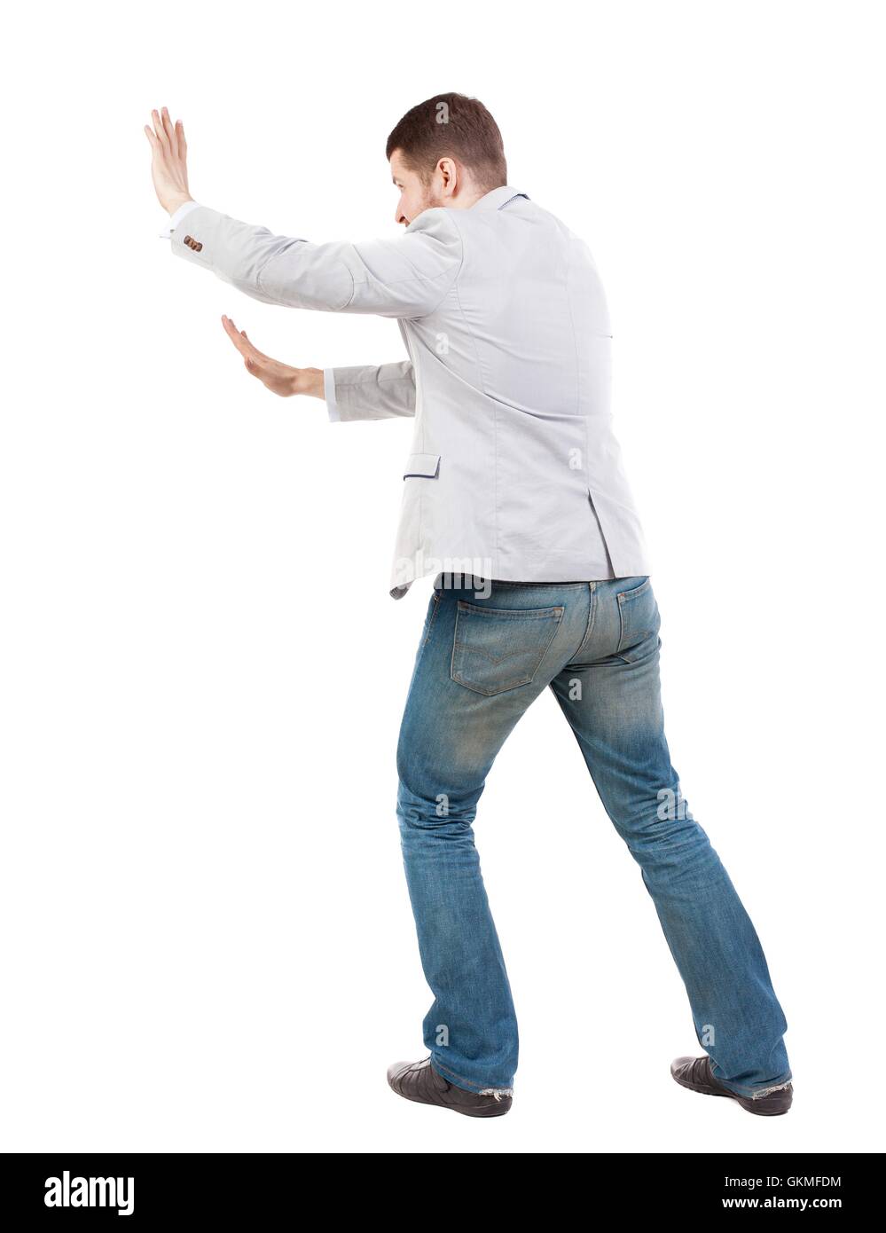 back view of business man pushes wall Stock Photo - Alamy