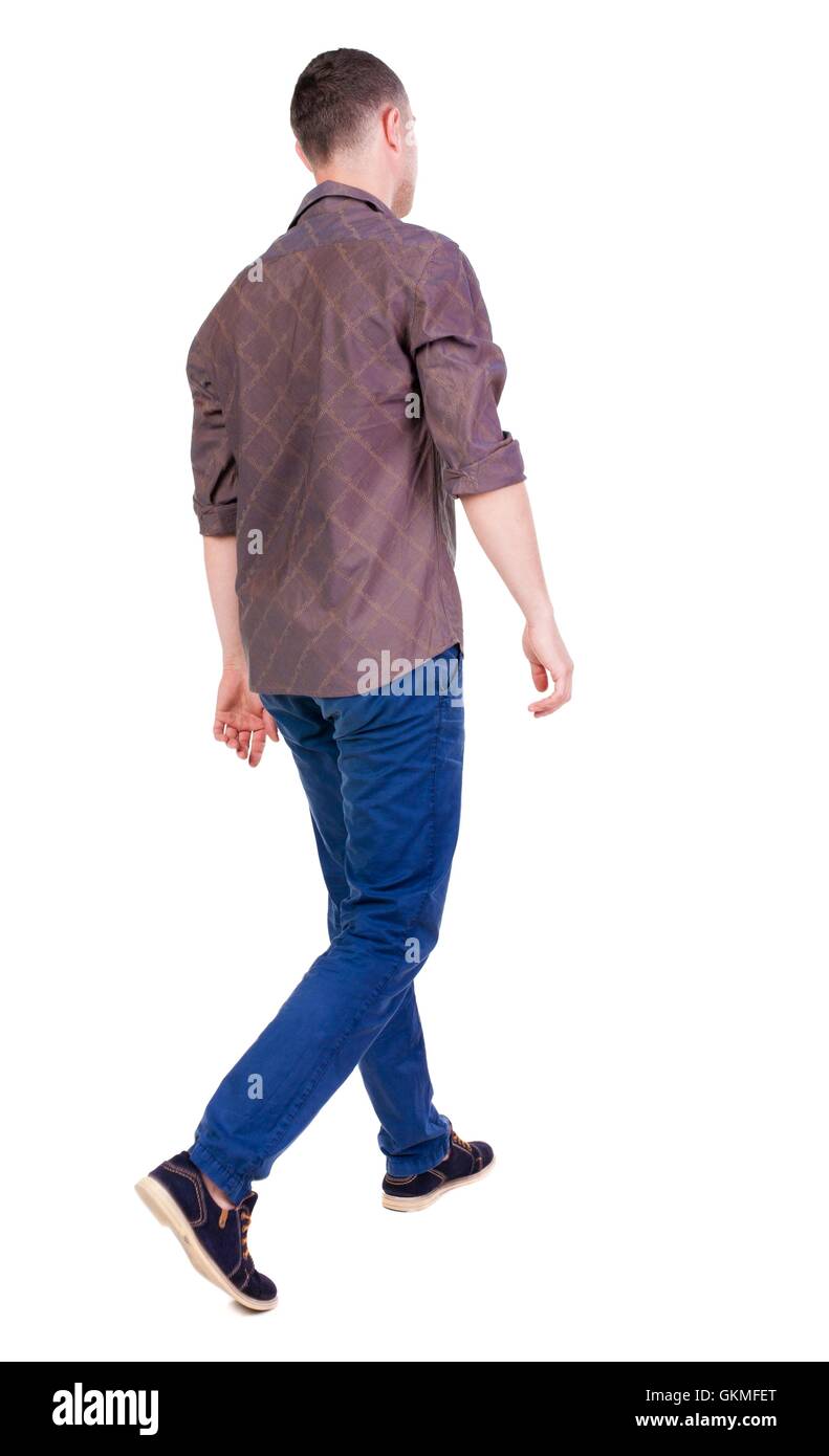 Back view of going handsome man in jeans and a shirt Stock Photo - Alamy