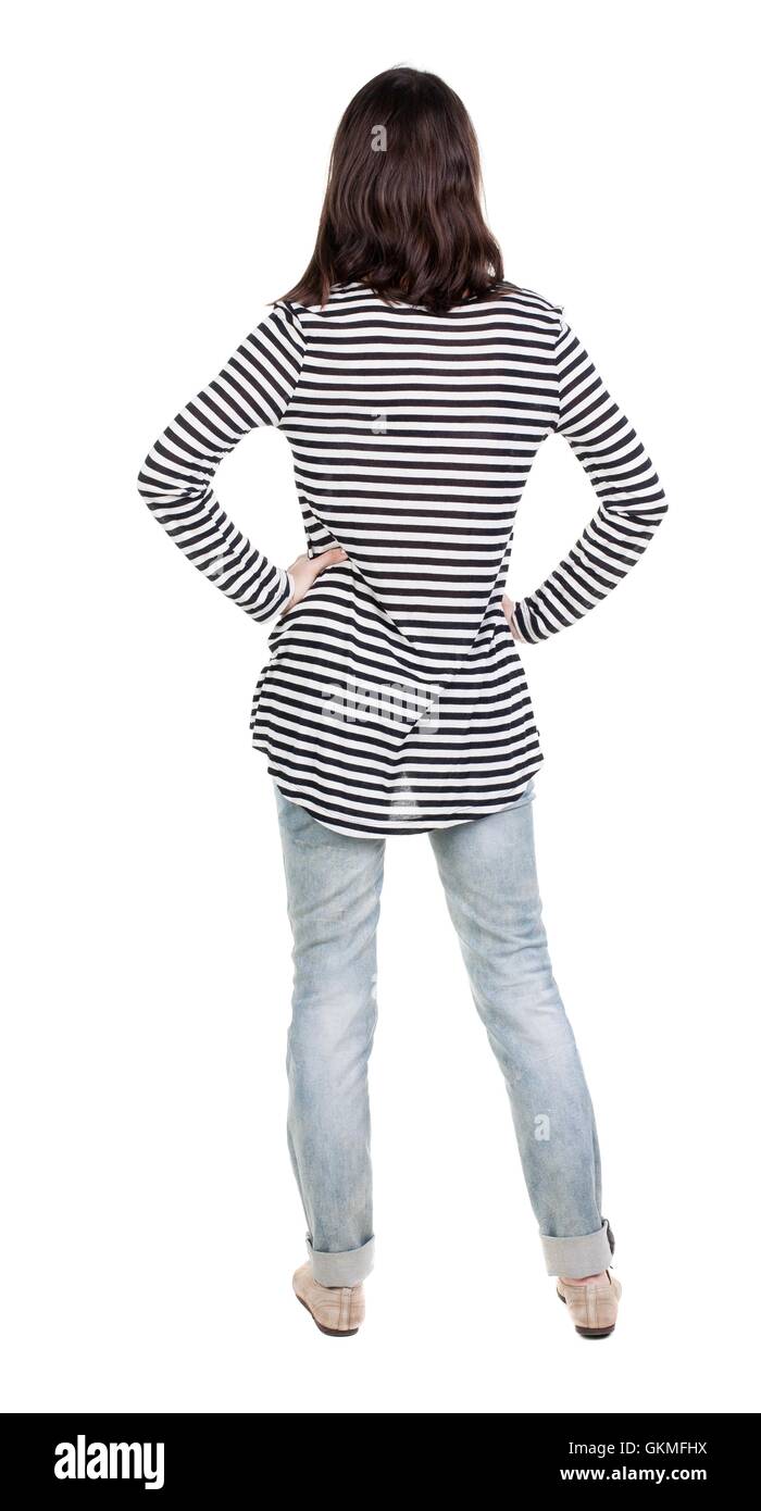 back view of standing young beautiful brunette woman in striped Stock ...