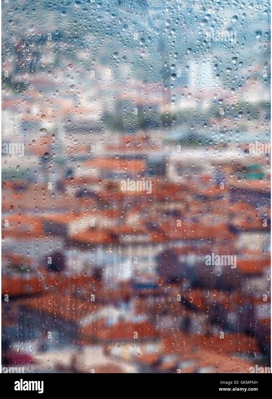 Autumn, rainy city through a window with raindrops Stock Photo - Alamy