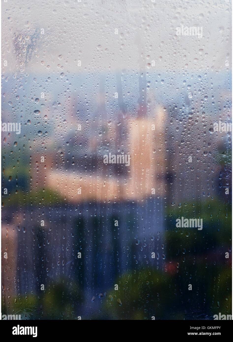 Autumn, rainy city through a window with raindrops Stock Photo - Alamy