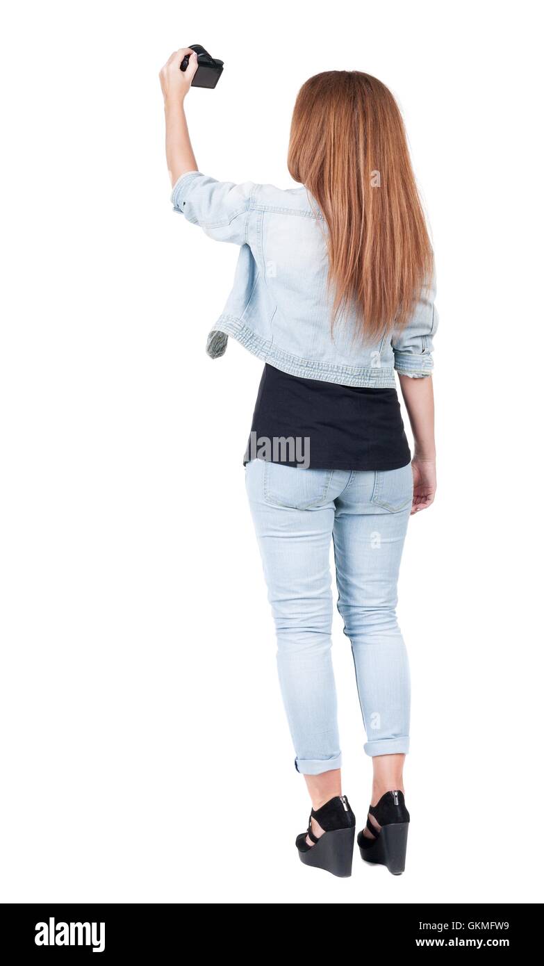 Back view of woman photographing Stock Photo - Alamy