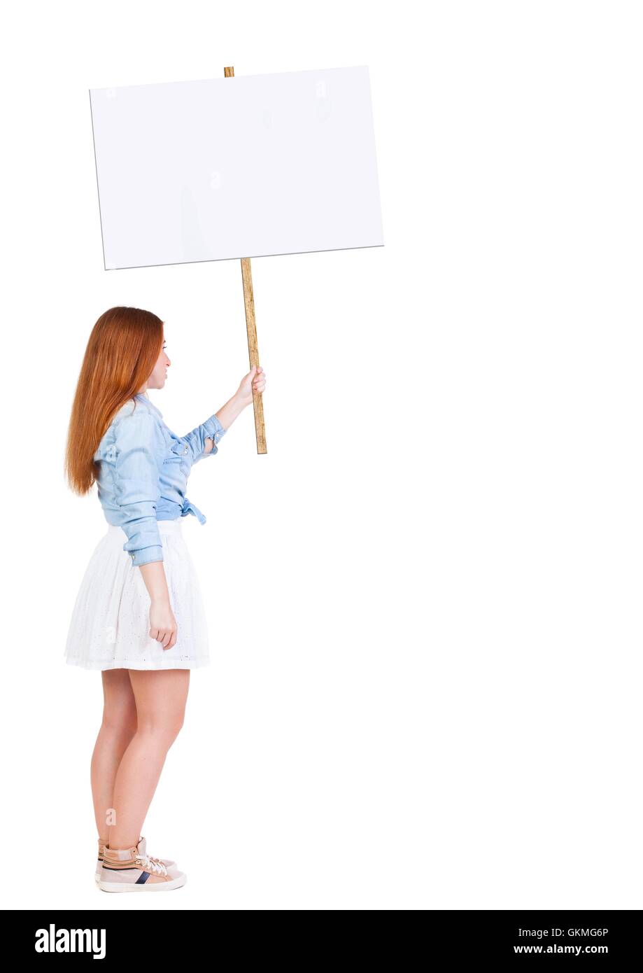 Back view of woman showing a sign board Stock Photo - Alamy