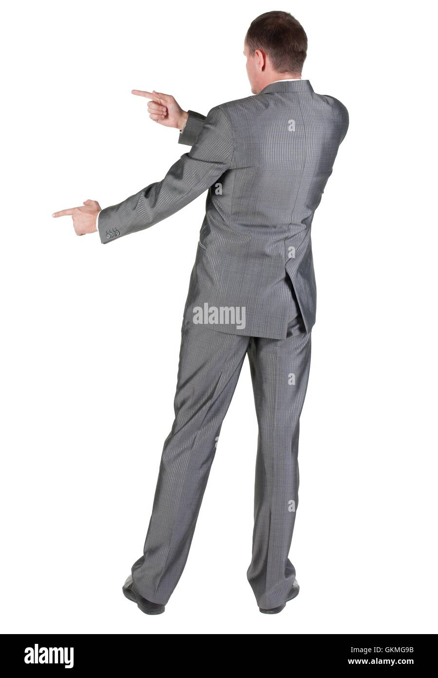 Businessman pointing at wall. rear view Stock Photo - Alamy