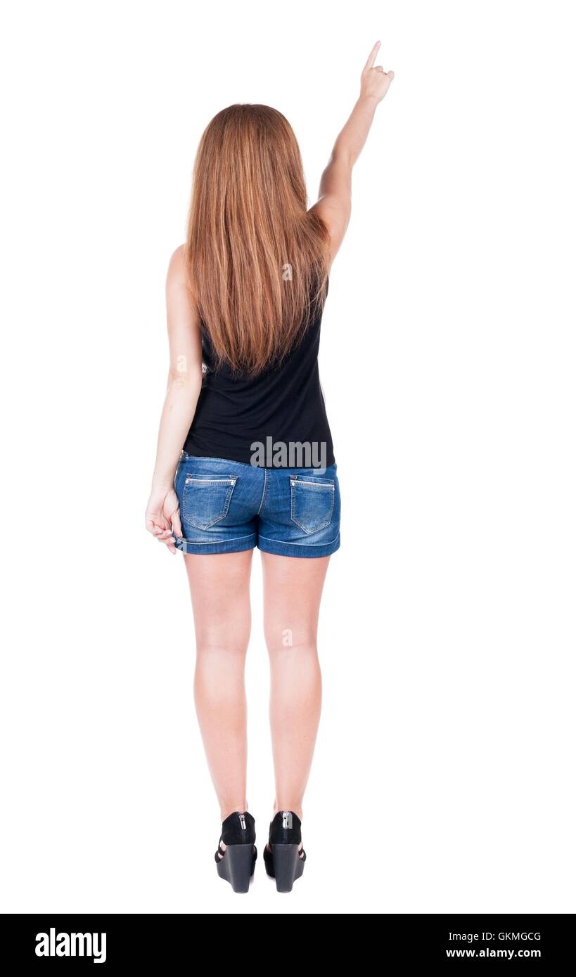 Back view of pointing woman Stock Photo - Alamy