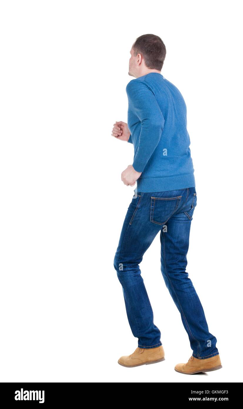 back view of running man in blue pullover Stock Photo - Alamy