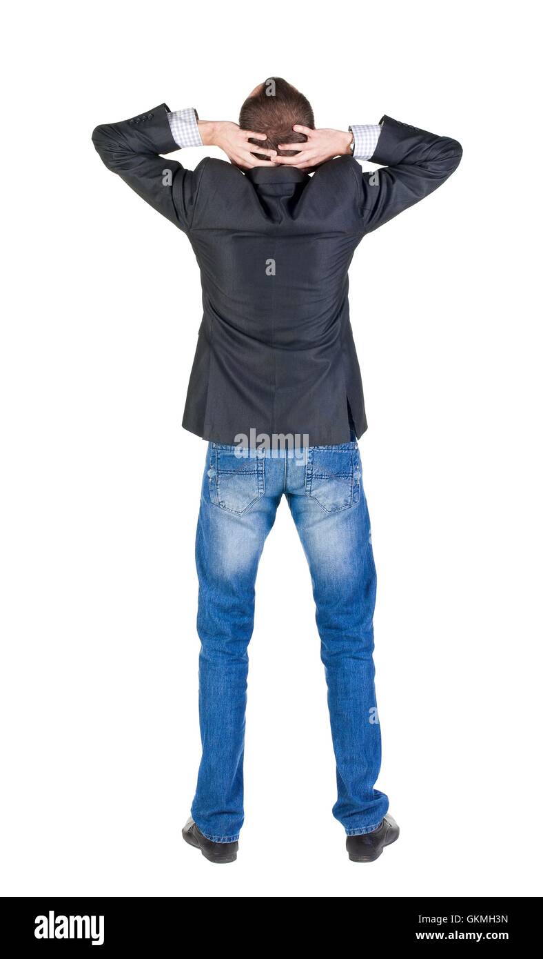 Back view of shocked and scared young business man. Holds hands Stock ...