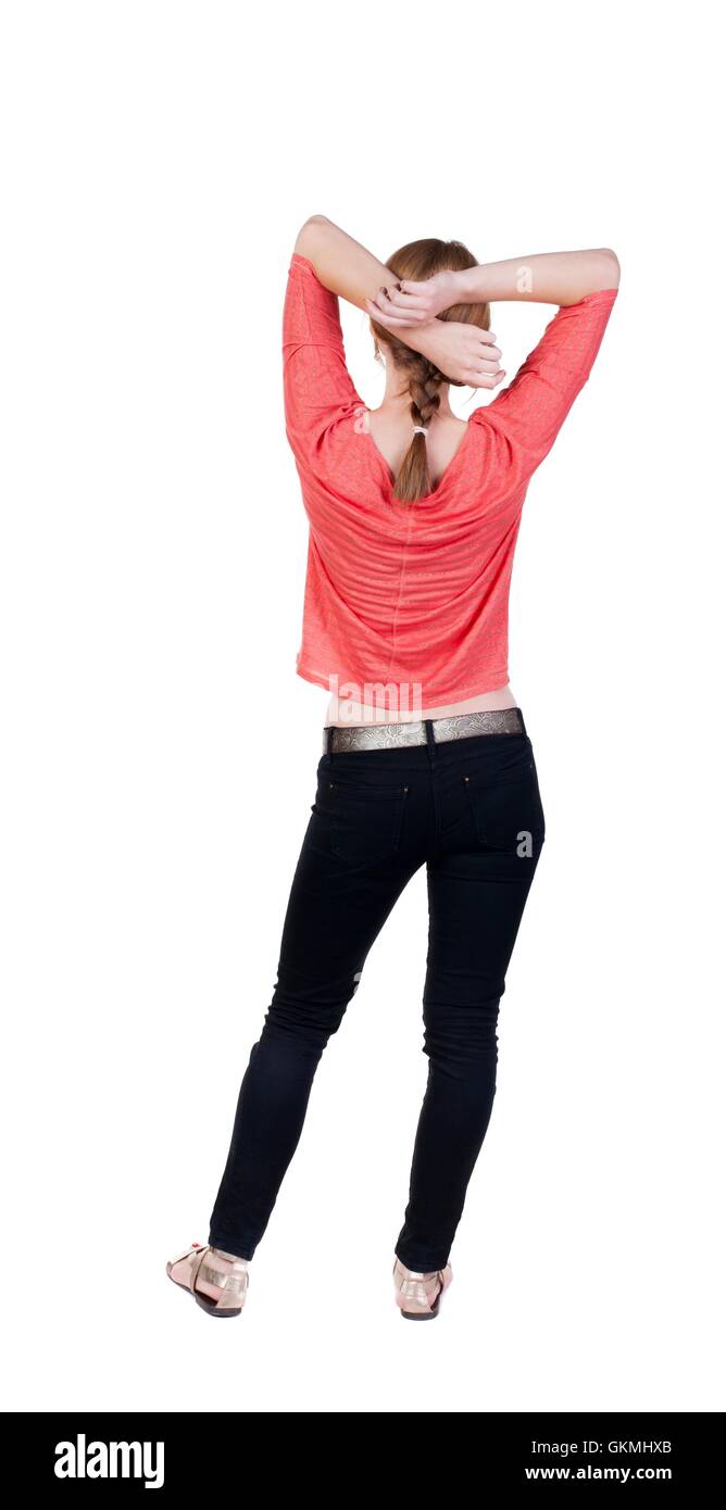 back view of standing young beautiful blonde woman in jeans. girl ...