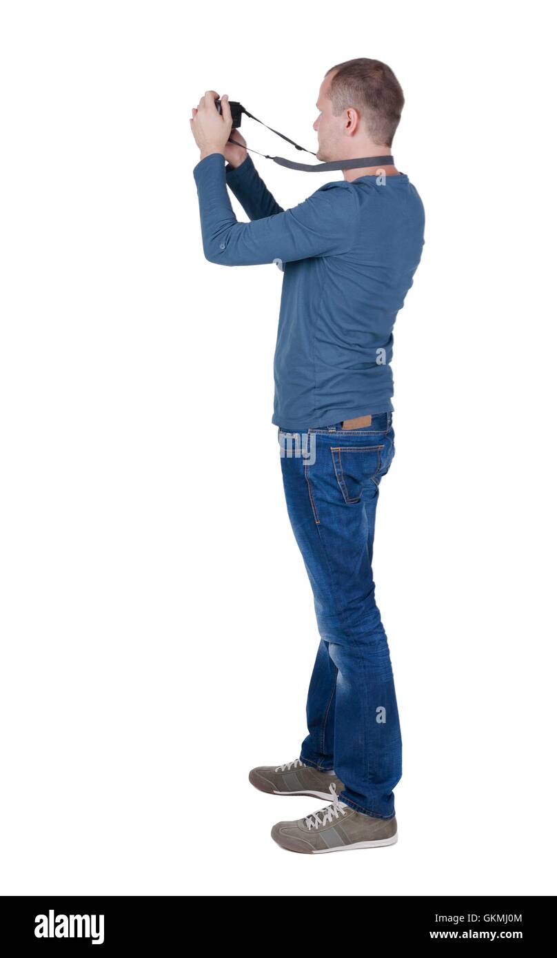 Back view of man photographing. photographer in jeans. Rear view people ...