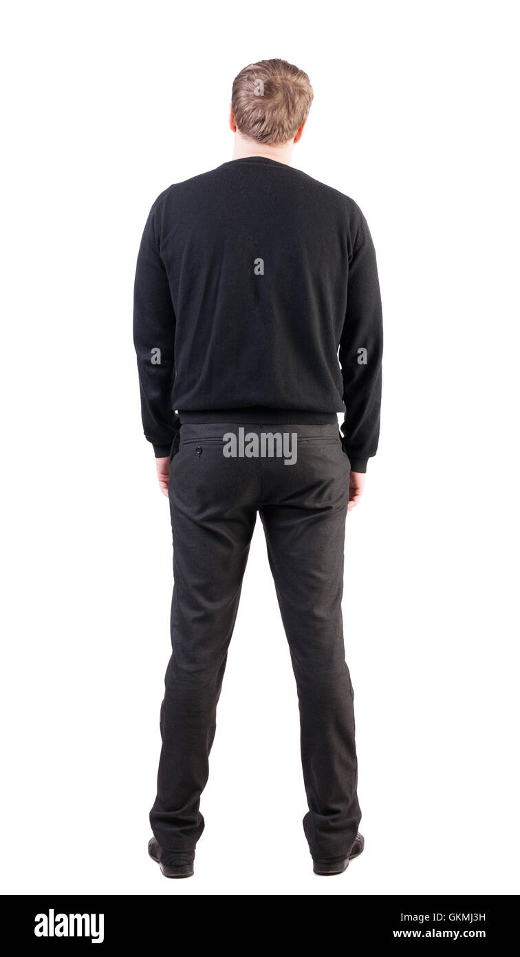 back view of Business man looks ahead. Young guy in sweater watching ...