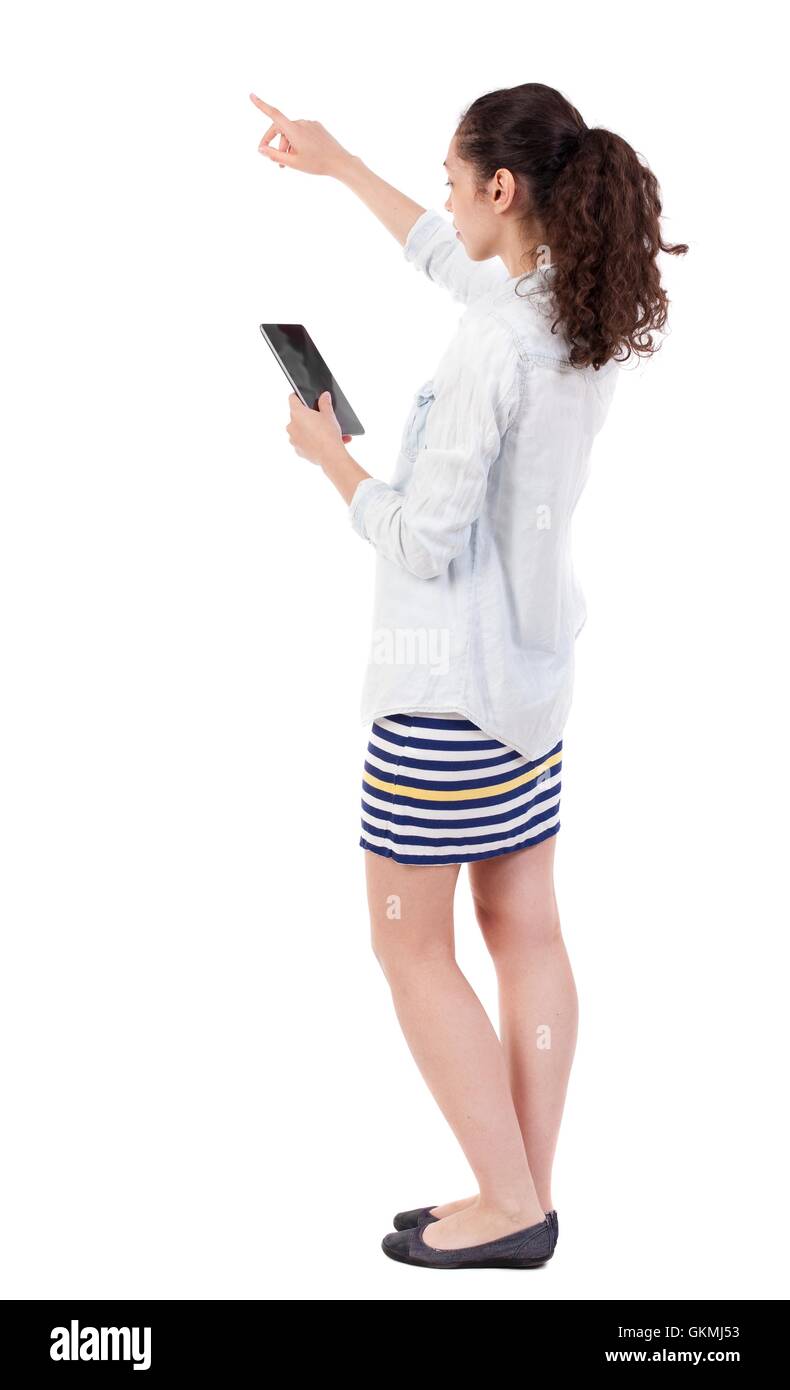 back view of pointing young beautiful girl with tablet computer. girl ...