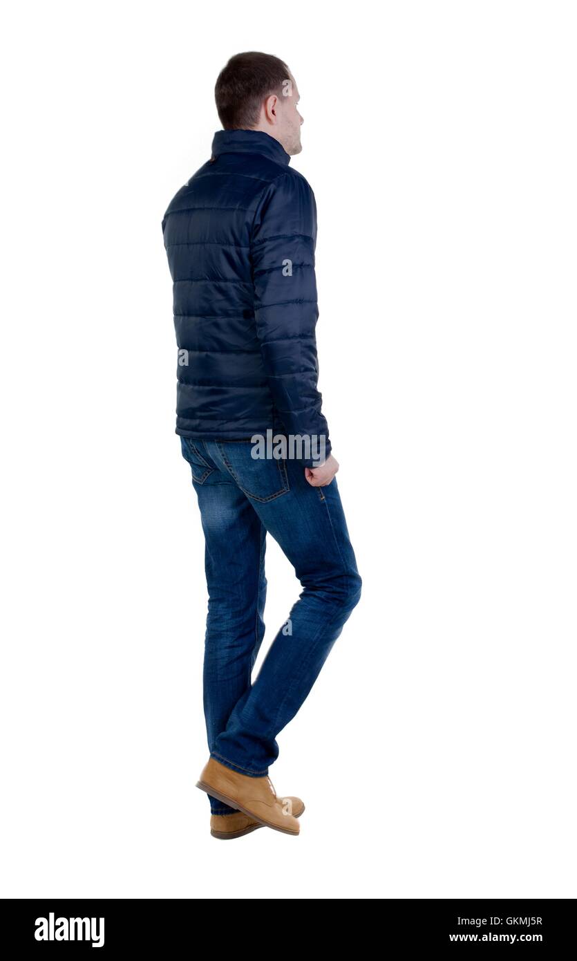 Back view of going handsome man in jeans and jacket. walking young guy ...