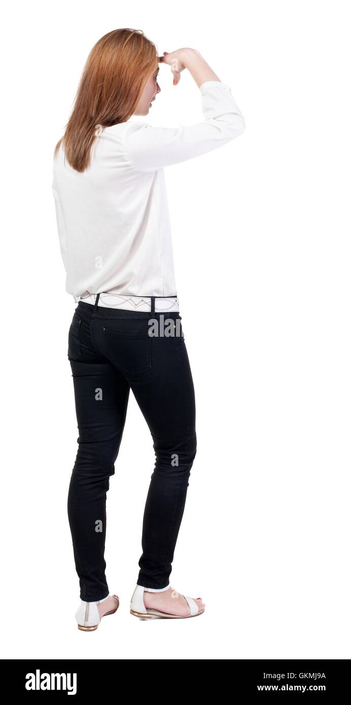 back view of standing young beautiful blonde woman in jeans. girl ...