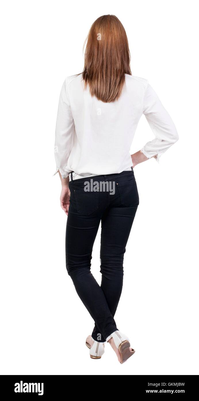 back view of standing young beautiful blonde woman in jeans. girl ...