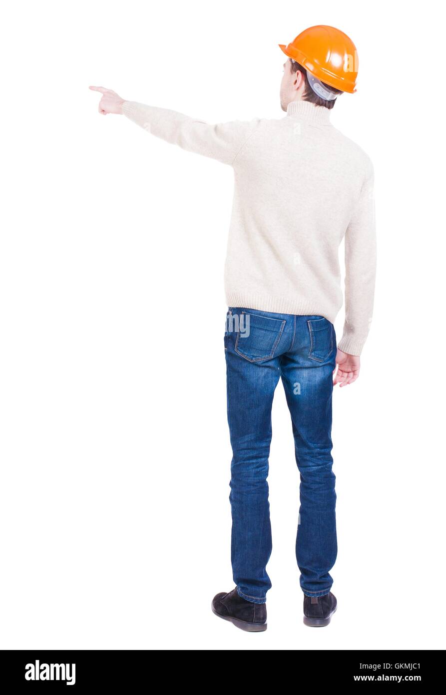 Back view of pointing young men in helmet. Young guy gesture. Rear view ...