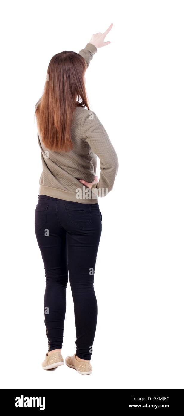 Back view of pointing woman. beautiful girl. Rear view people ...