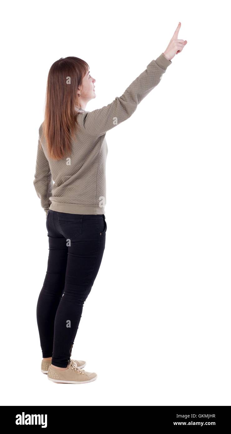 Back view of pointing woman. beautiful girl. Rear view people ...