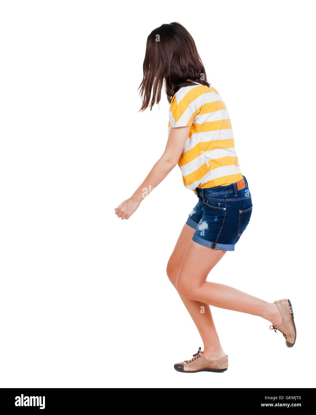 back view of running woman. beautiful brunette girl in motion. backside ...