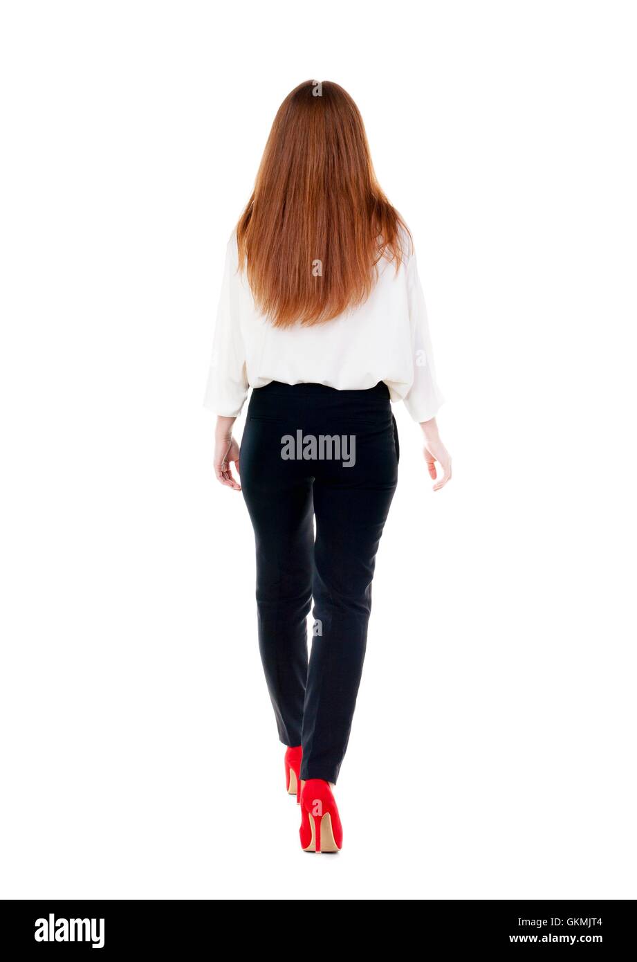 Woman walking looking behind Cut Out Stock Images & Pictures - Alamy