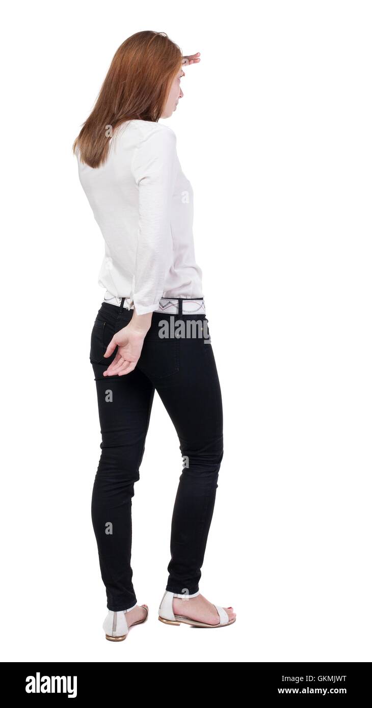 back view of standing young beautiful blonde woman in jeans. girl ...