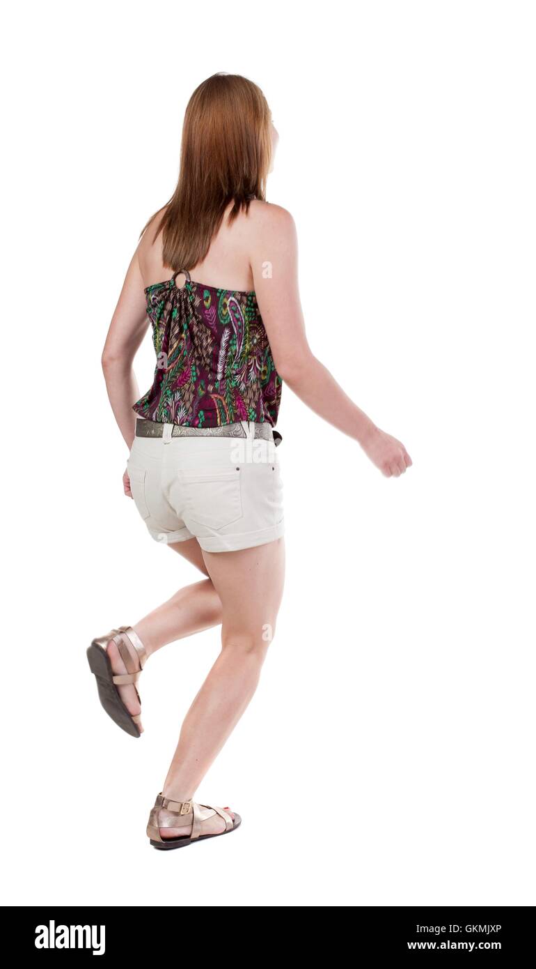 back view of running woman white shorts. beautiful blonde girl in ...