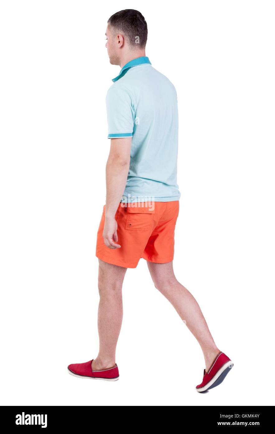 Back view of going handsome man in shorts. walking young guy . Rear ...
