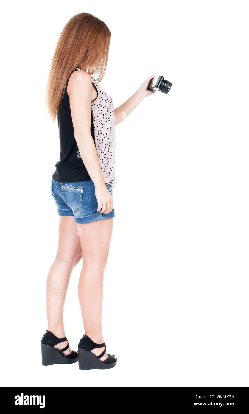 Back view of woman photographing Stock Photo - Alamy
