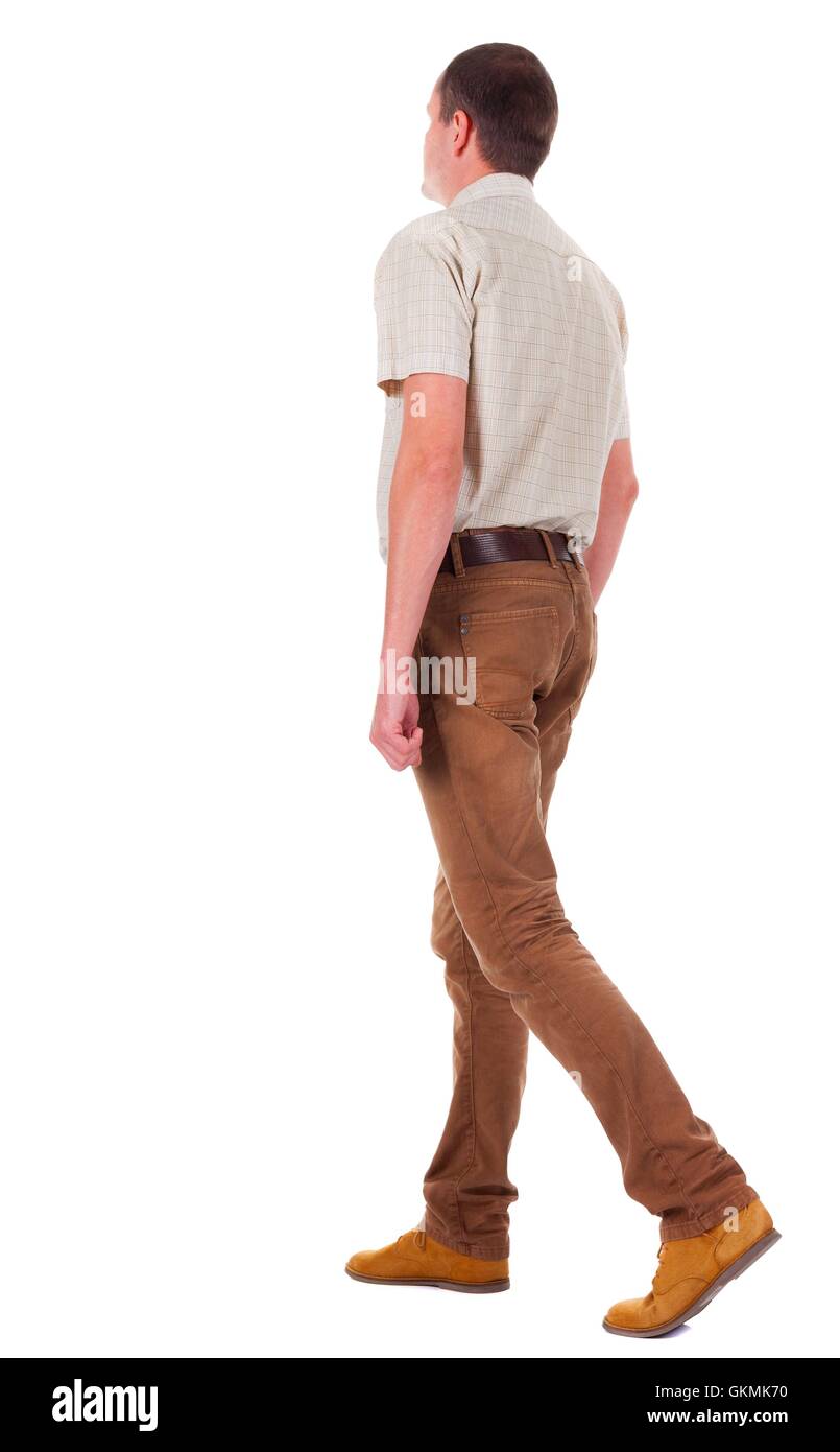 Back view of going handsome man in jeans and a shirt. walking young guy ...