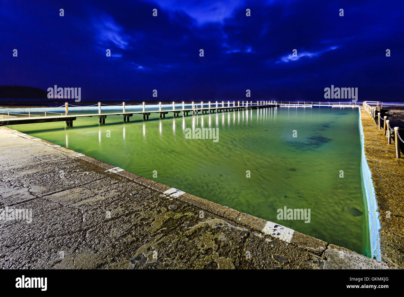Wide olympic sized 50m rock pool at Collaroy beach of Sydney at sunrise ...