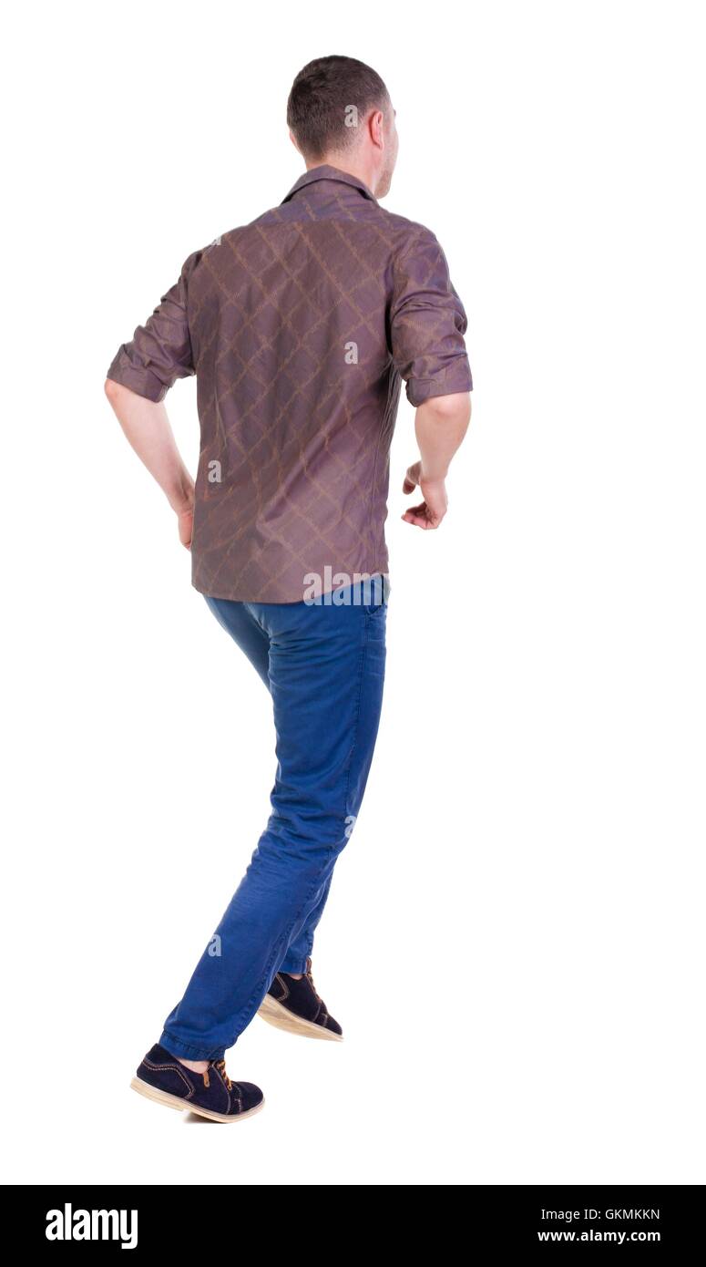 Back view of running man in brown shirt. Walking guy in motion. Rear ...