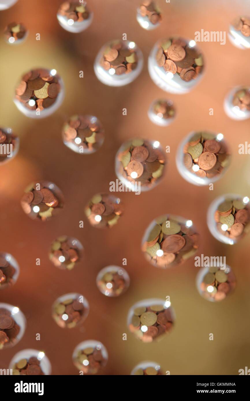 euro coins in water drops Stock Photo - Alamy