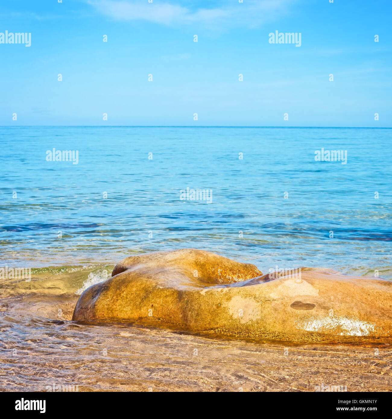 Stone in a Sea Stock Photo - Alamy