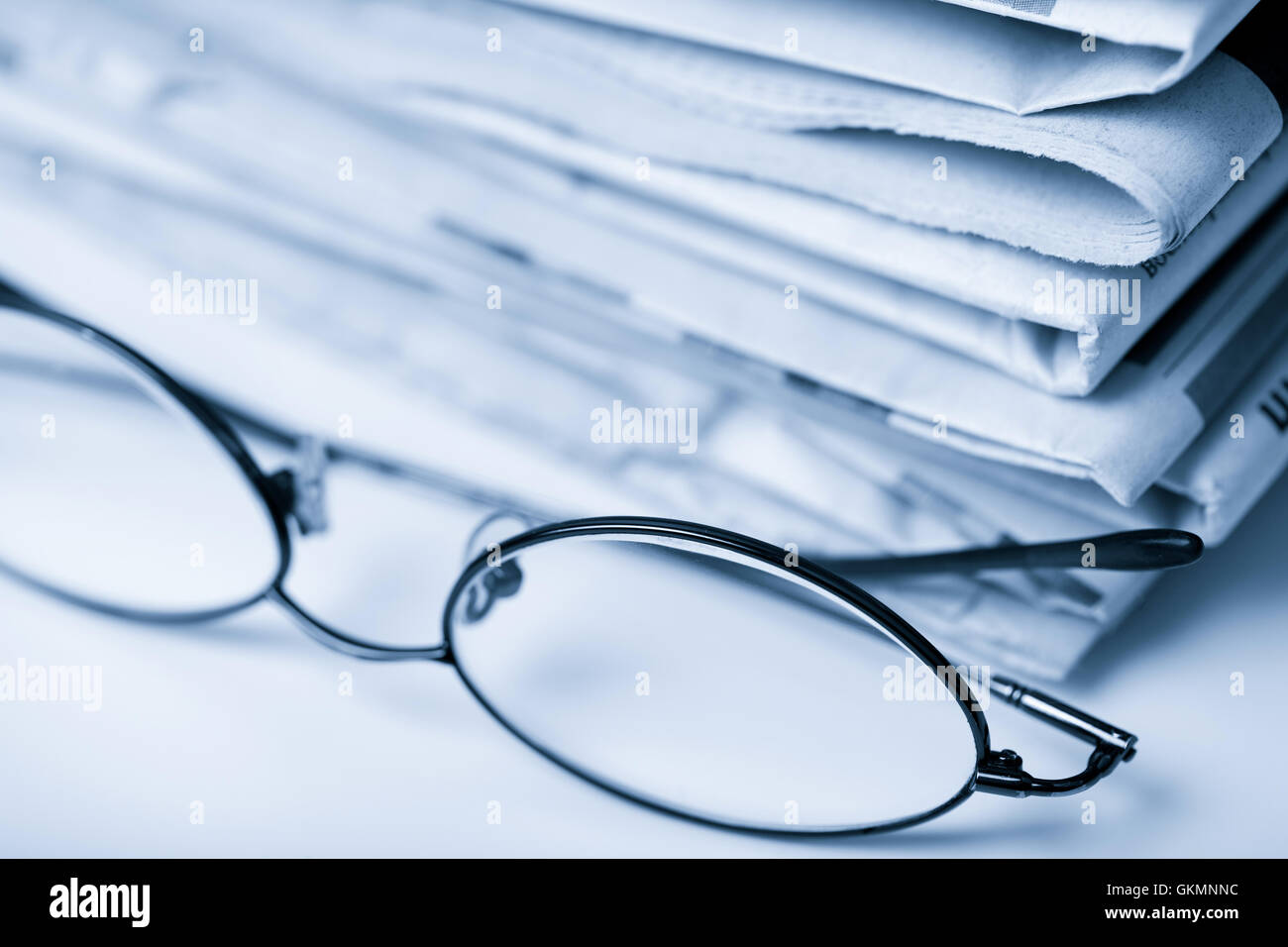 Pile of newspapers blue background hi-res stock photography and images ...
