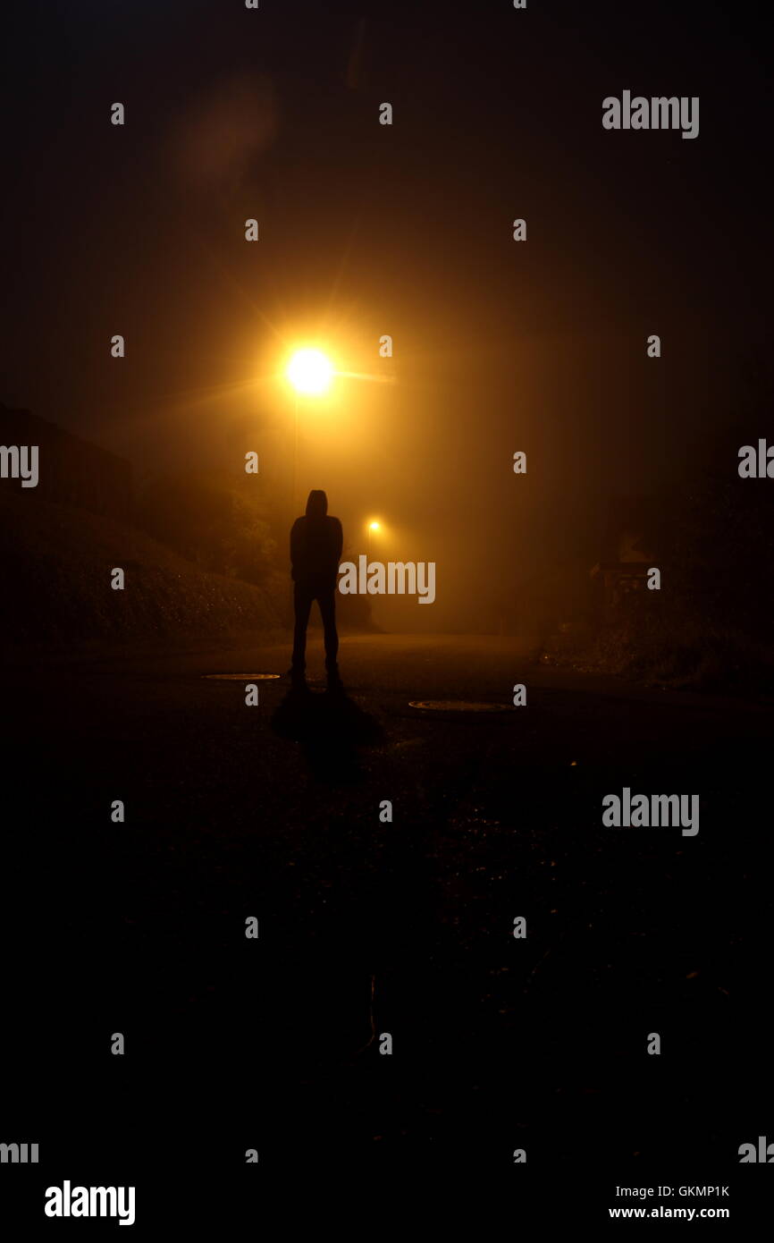 shadow of a man in the night Stock Photo - Alamy