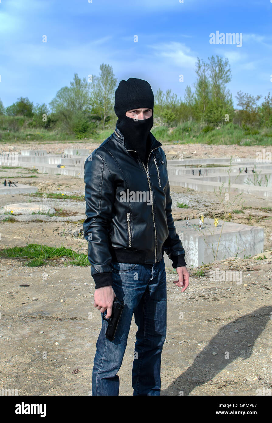 Thug in mask gun in hi-res stock photography and images - Alamy