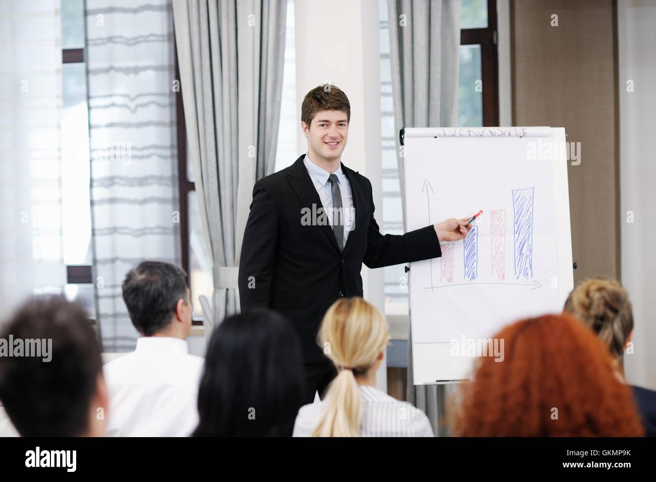 Young business man giving a presentation on conference Stock Photo - Alamy