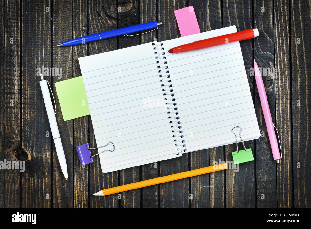 Empty notepad and office tools on wooden table Stock Photo - Alamy