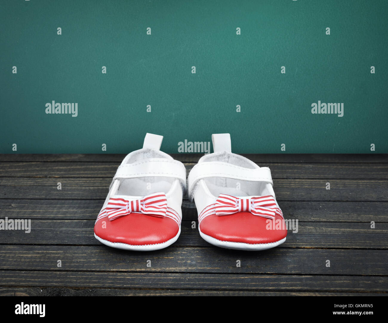 Kid shoes on school table Stock Photo - Alamy