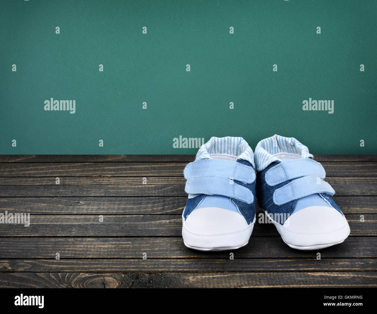 Kid shoes on school table Stock Photo - Alamy