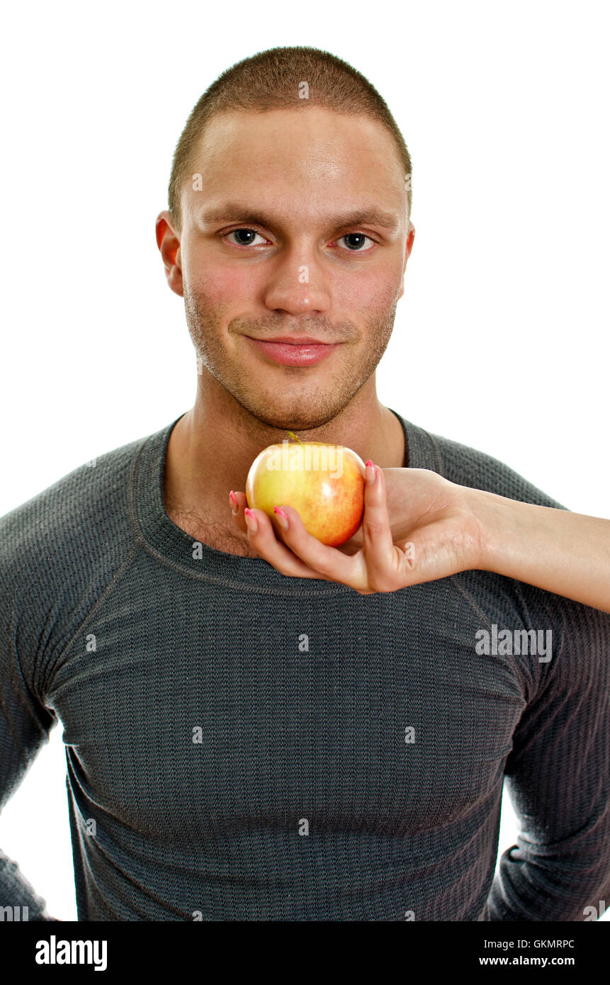 Woman's hand offering an apple to man. Isolated on white Stock Photo ...