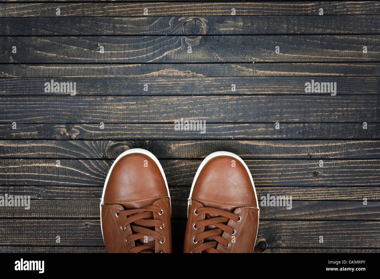 Sport shoes on wooden floor Stock Photo - Alamy