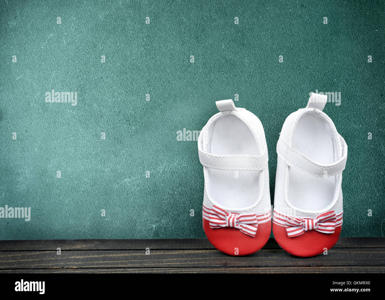 Kid shoes on school table Stock Photo - Alamy