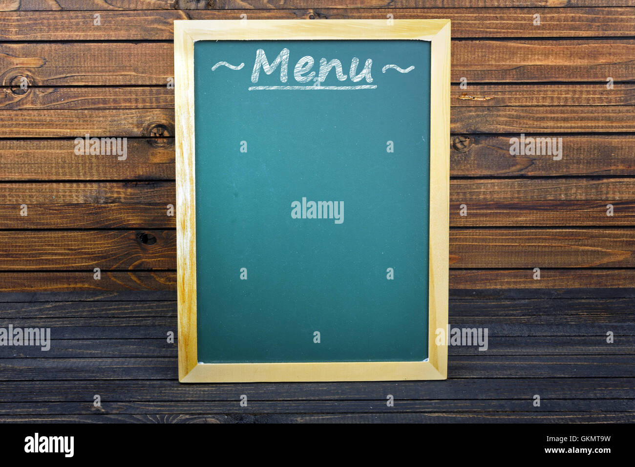 Menu board on wooden table Stock Photo - Alamy